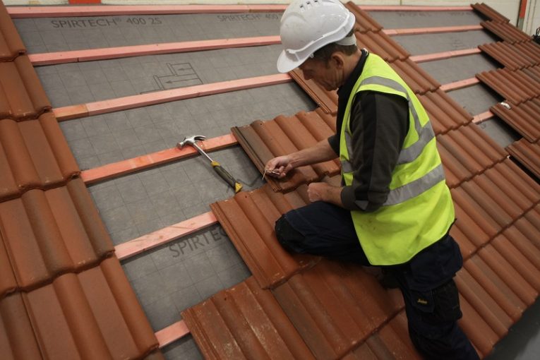 Roger Bisby Raises the Roof With Redland's Innofix Clip - Professional ...