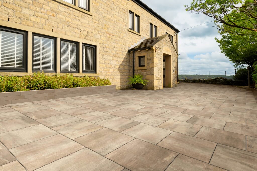 infinia-patio-bronze-sandstone-hero - Professional Builder